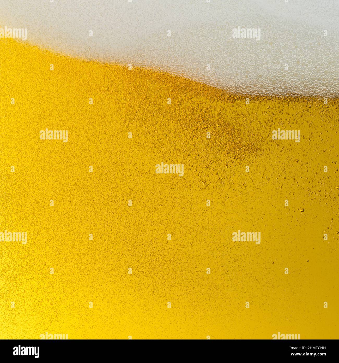 Beer wave with foam crown and bubbles Stock Photo - Alamy