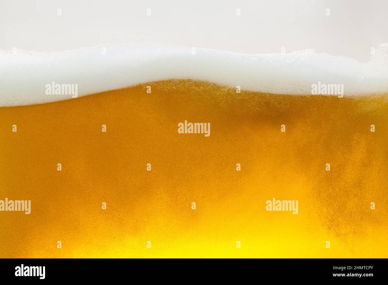 Golden Beer wave with foam Stock Photo - Alamy