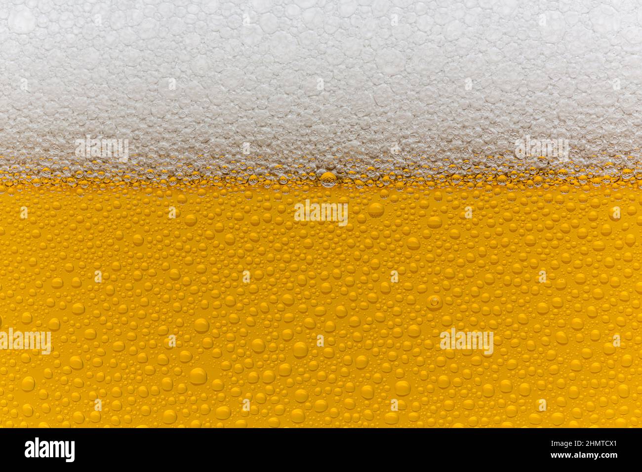 Beer foam with drops of condensation Stock Photo - Alamy