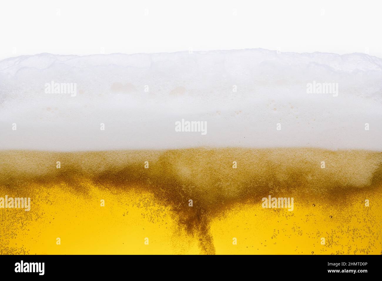 Pouring beer with bubble froth in glass for background isolated on ...