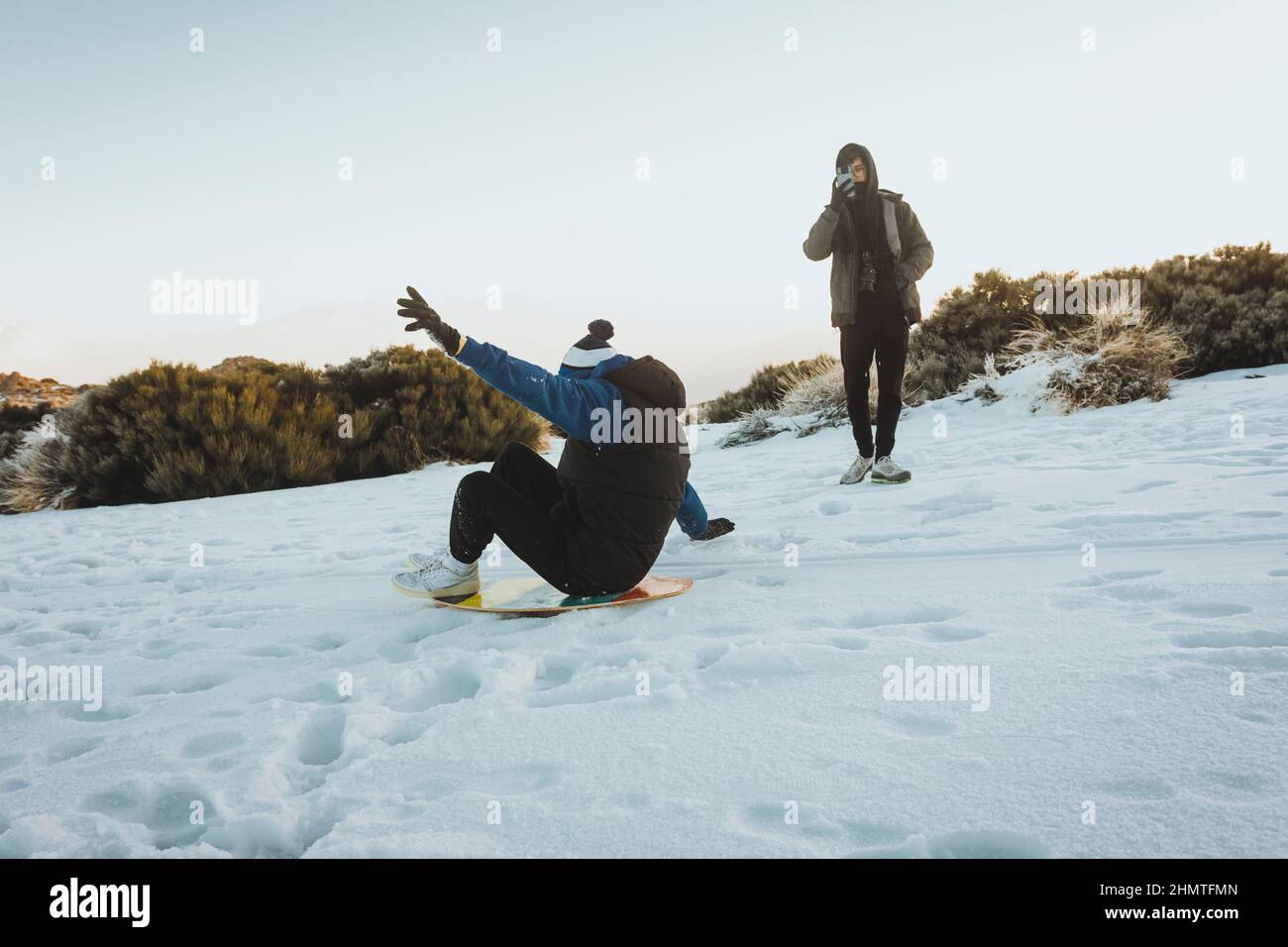 Young people having fun in the snow Stock Photo - Alamy