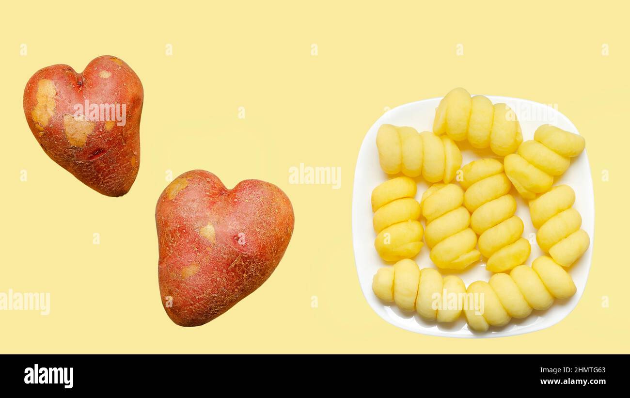 Whole new potatoes in the shape of a heart and raw cut into a spiral on ...