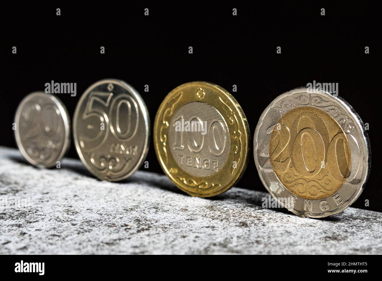 Kazakh coins in denominations of 20, 50, 100 and 200 tenge stand on a ...