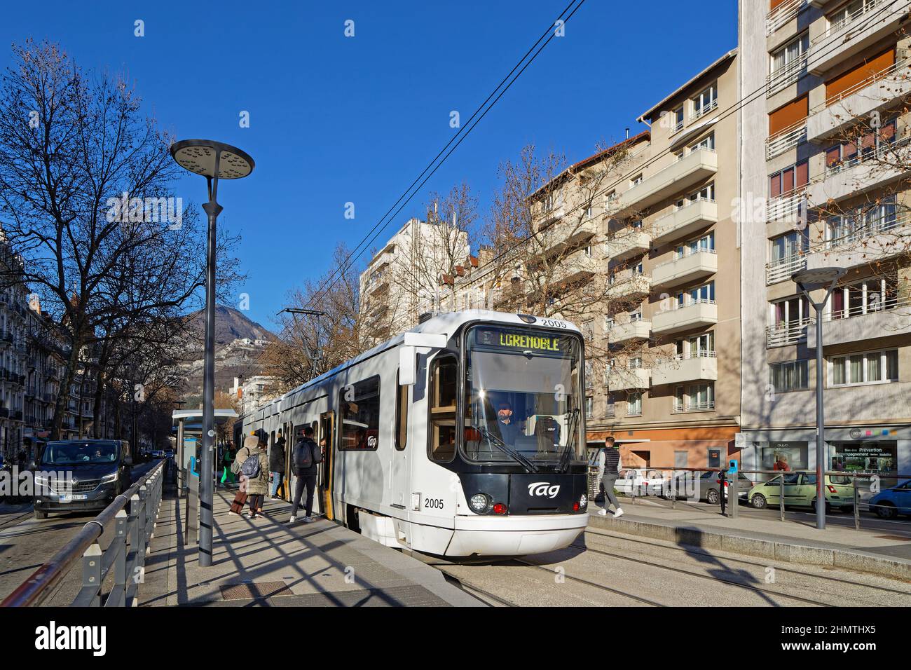 GRENOBLE, FRANCE, February 8, 2022 : White tramway car on the Jean ...