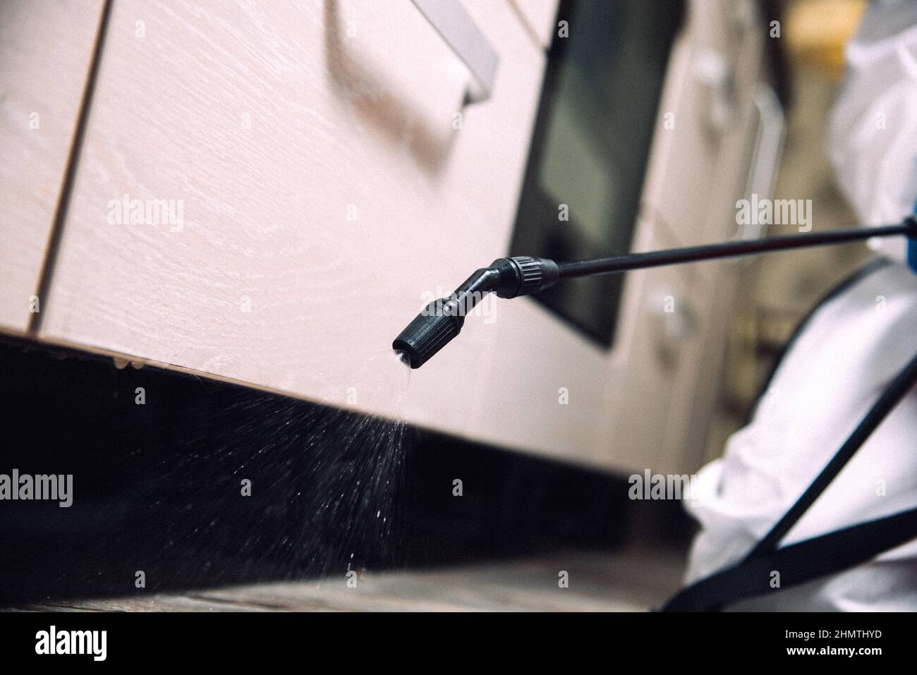 Spray gun with pesticides close-up. Fight against insects in apartments ...