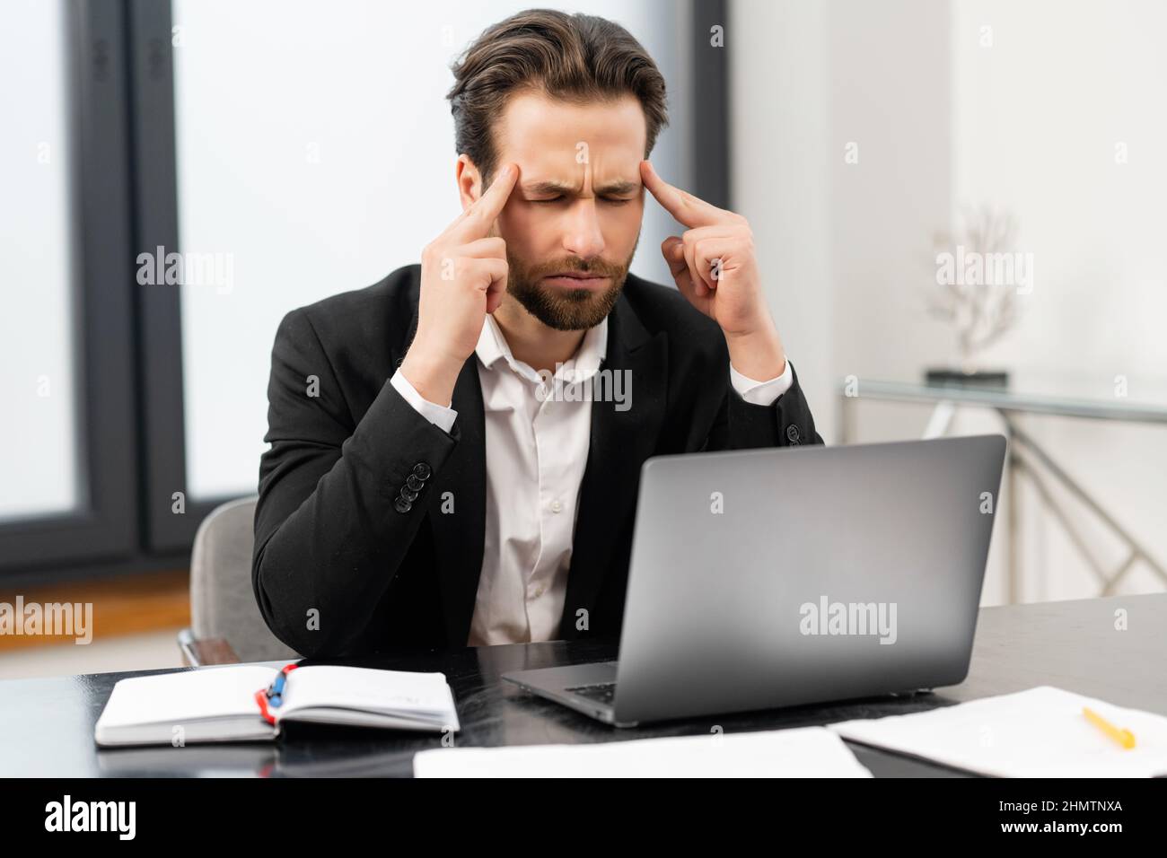 Tired businessman frown while checking financial documents, touching ...