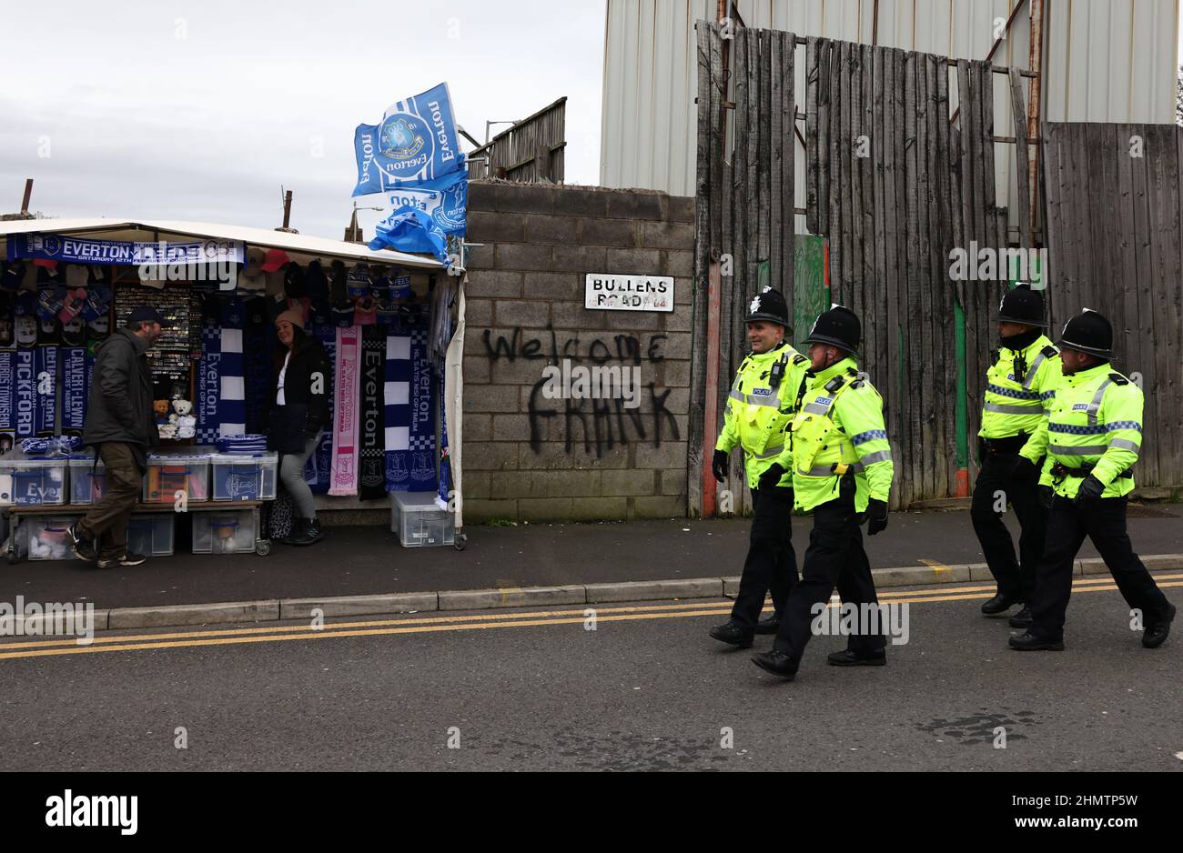 Liverpool, UK. 12th Feb, 2022. Police officers walk past a message to ...