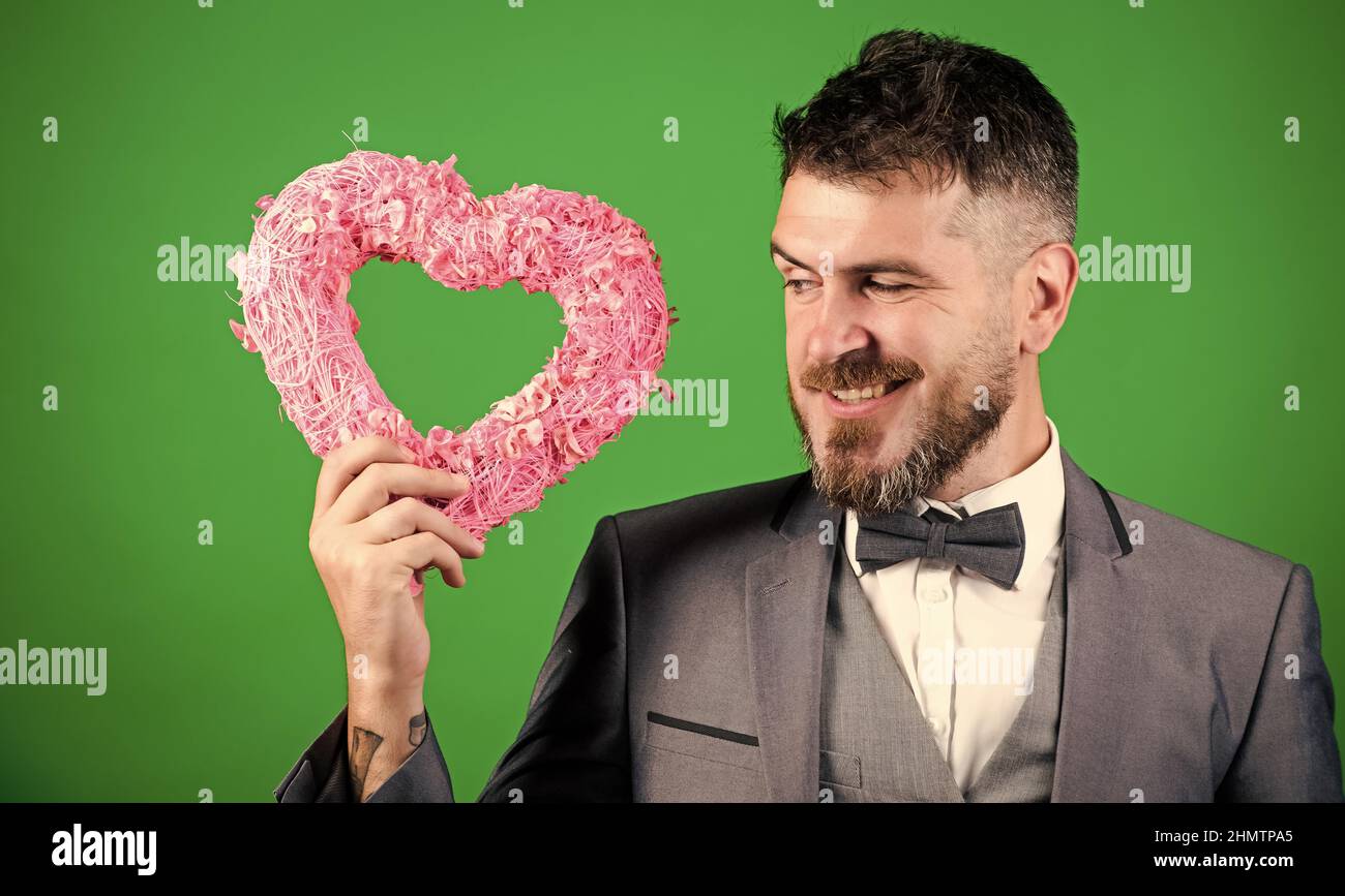 Hipster hold heart symbol love. Man formal suit celebrate valentines ...