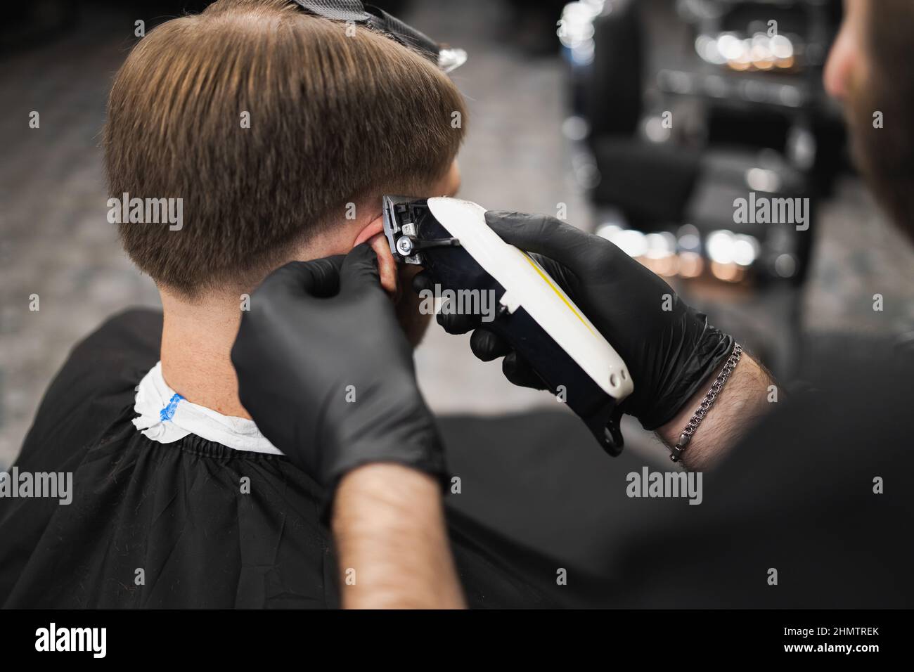Haircut and styling in barbershop. Man in barbershop Stock Photo - Alamy