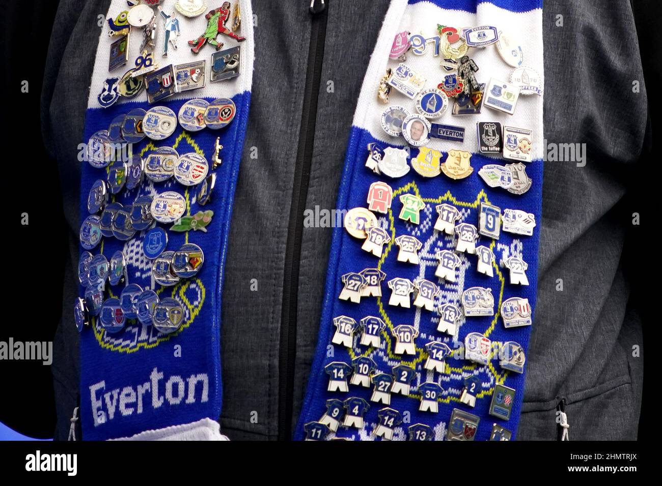 An Everton fan displays the badge collection on his scarf prior to the ...