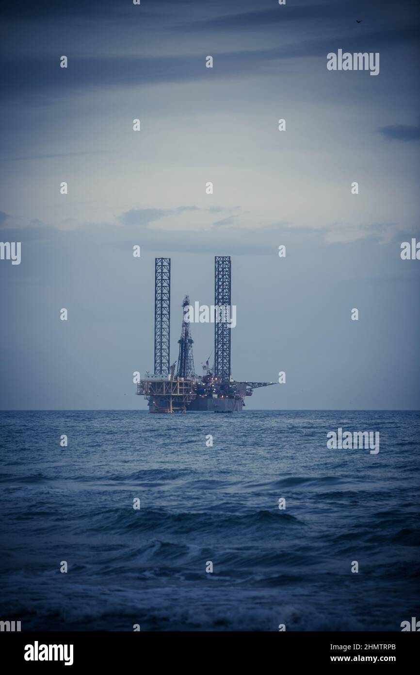 Color image of an oil platform on sea, at dusk Stock Photo - Alamy