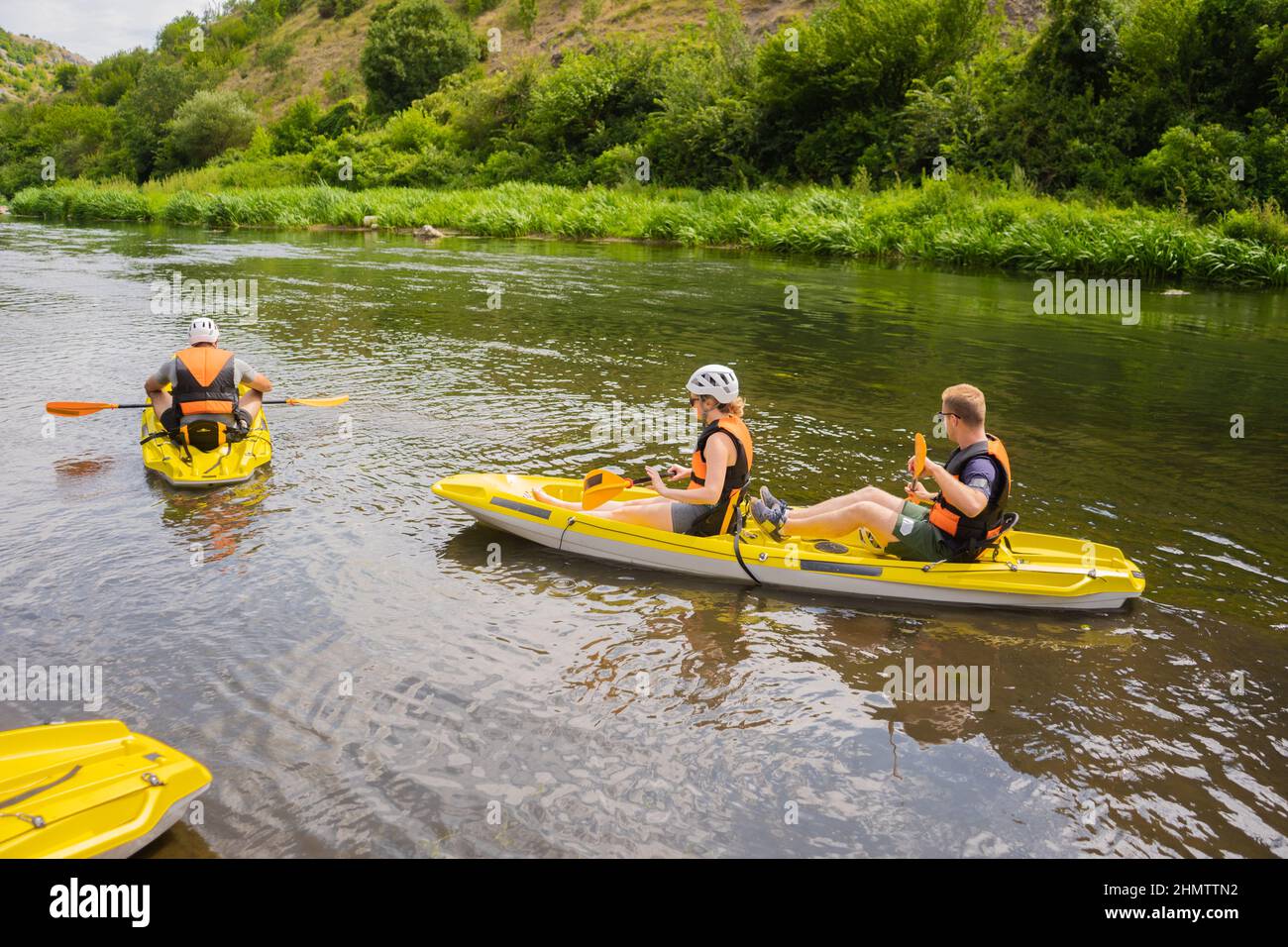 Happy friends are getting ready to start kayaking together Stock Photo ...