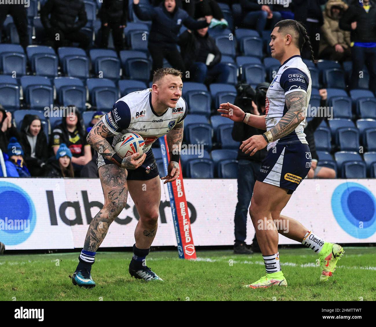 Josh Charnley #2 of Warrington Wolves celebrates his try Stock Photo ...