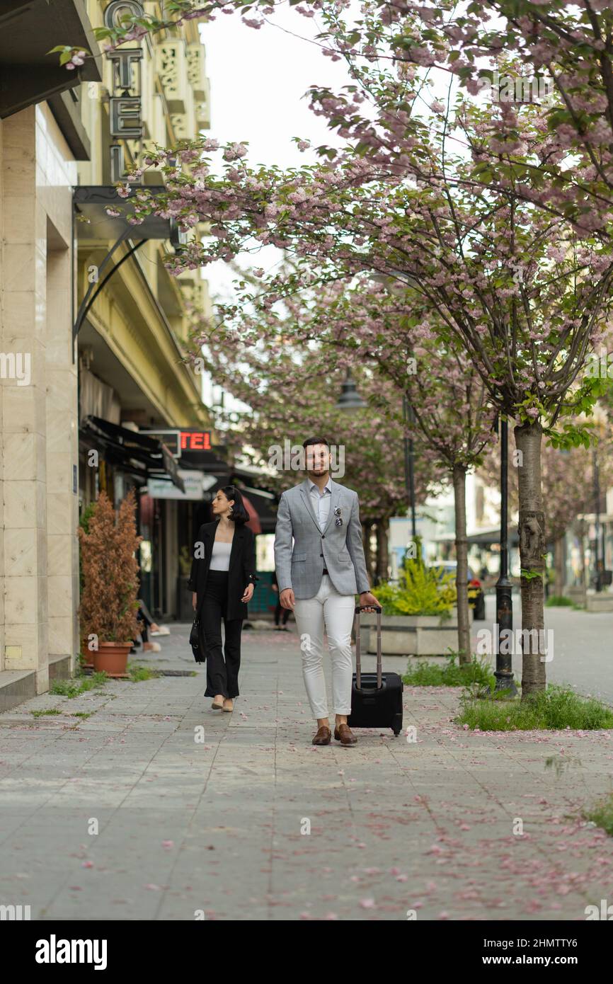 Two casual dressed business people are walking one by one Stock Photo ...