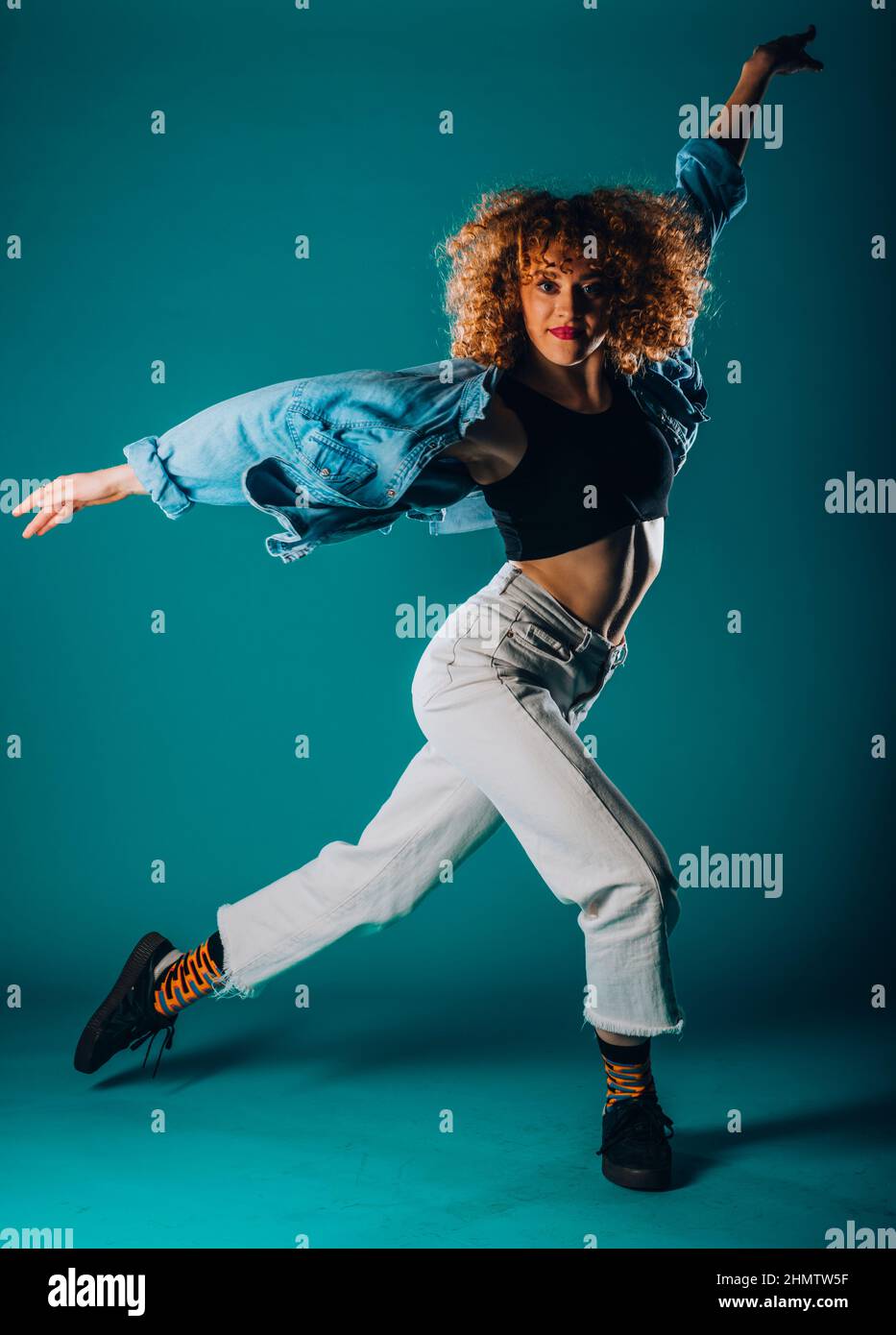 Dance moves performed by an acrobatic flexible female dancer Stock ...