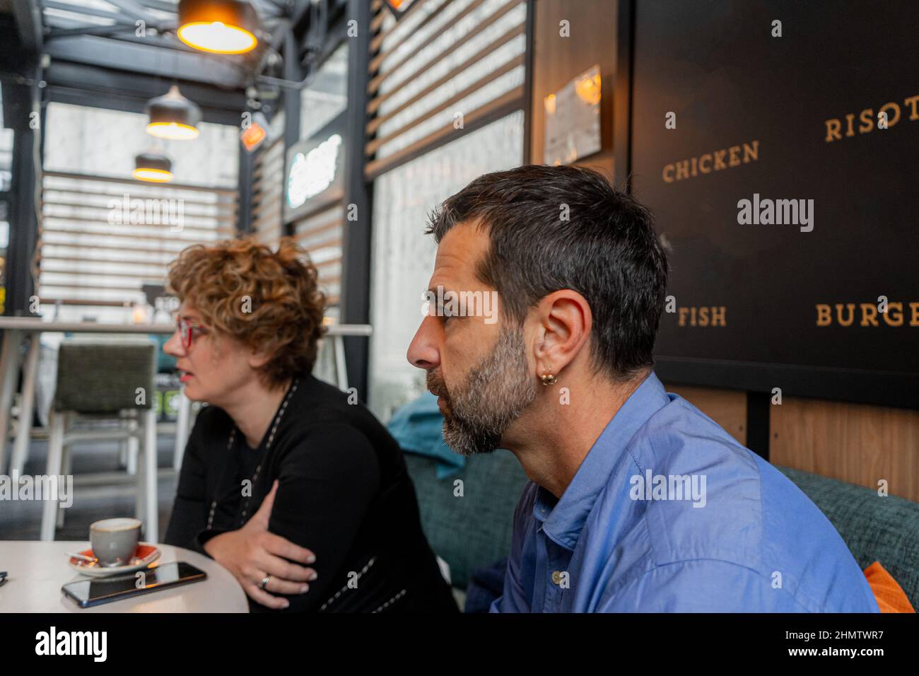 Three amazing business people are having a nice conversation togehter ...