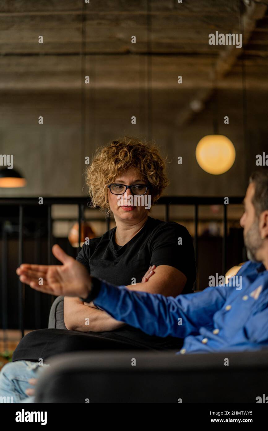 Two amazing and senior business people are having a serious discussion ...