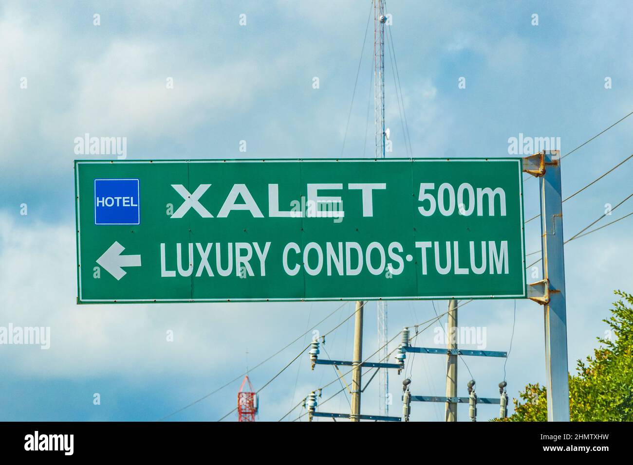 Tulum Mexico 02. February 2022 Green turquoise road sign on the road ...