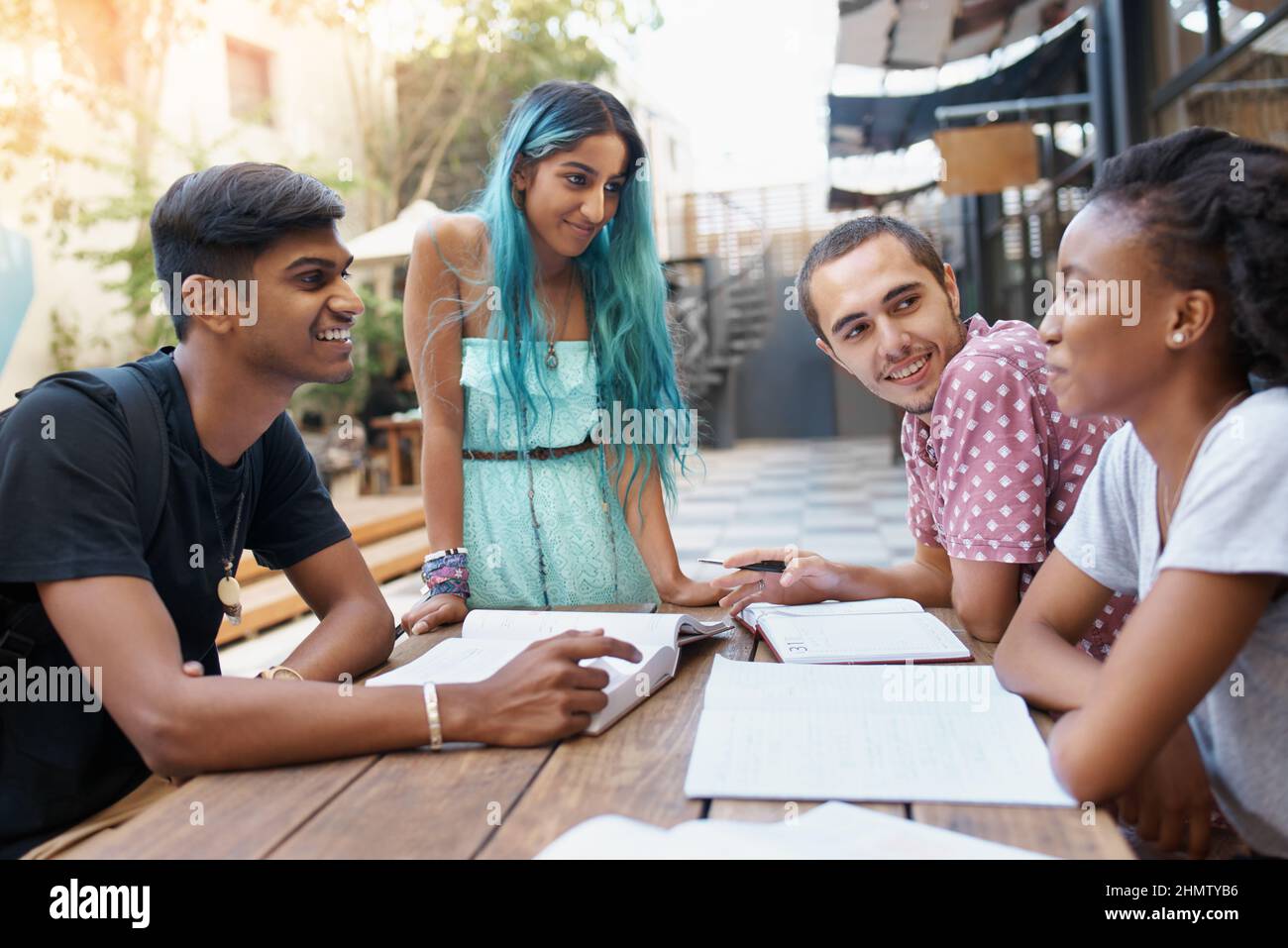 Multiracial group friends studying together hi-res stock photography ...
