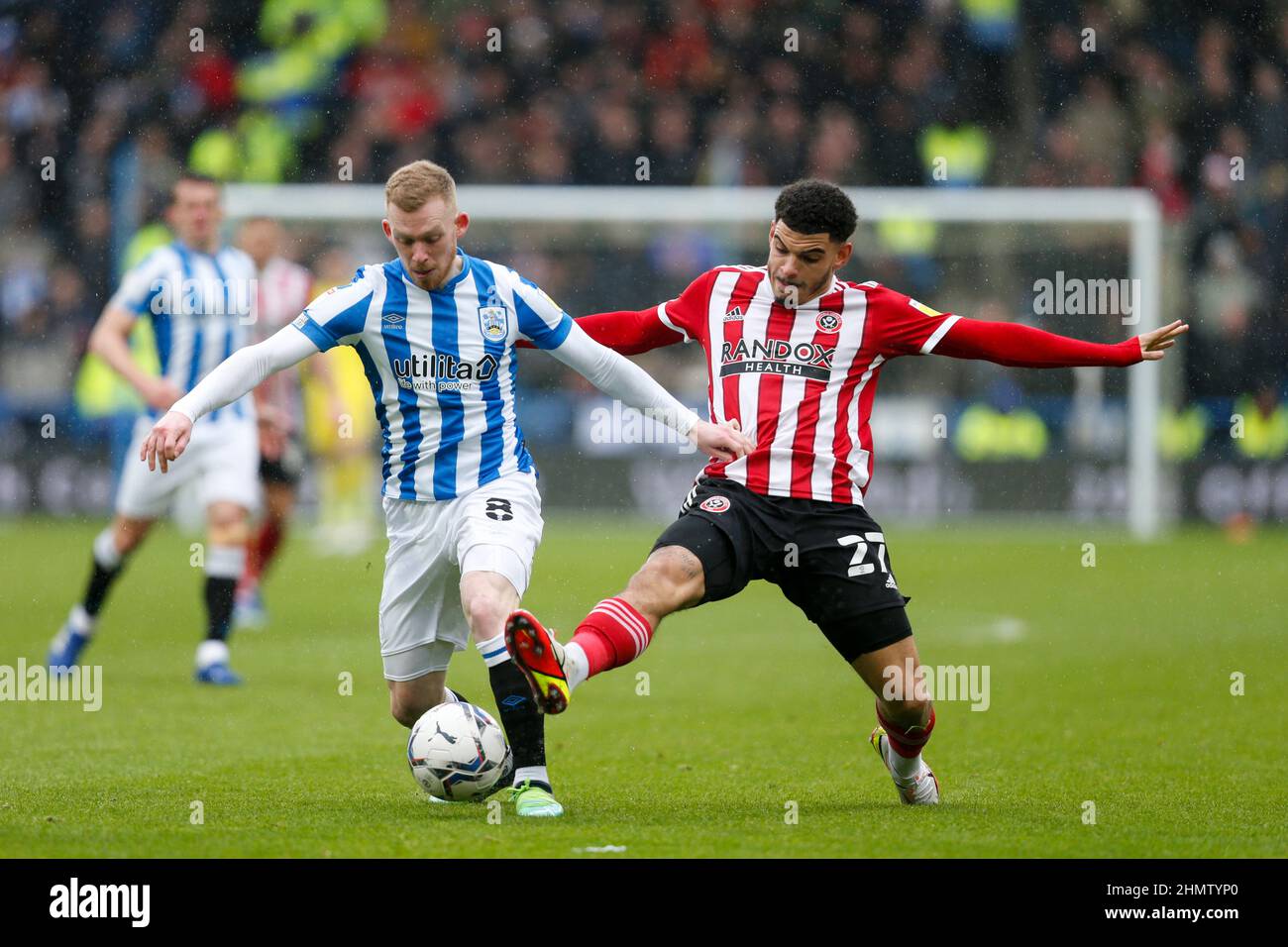 Lewis O'Brien #8 of Huddersfield Town and Morgan Gibbs-White #27 of ...