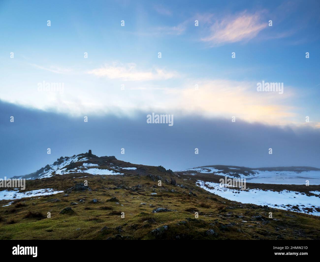 Cloud and mist clinging to the summit of Red Screes at dawn, Lake ...