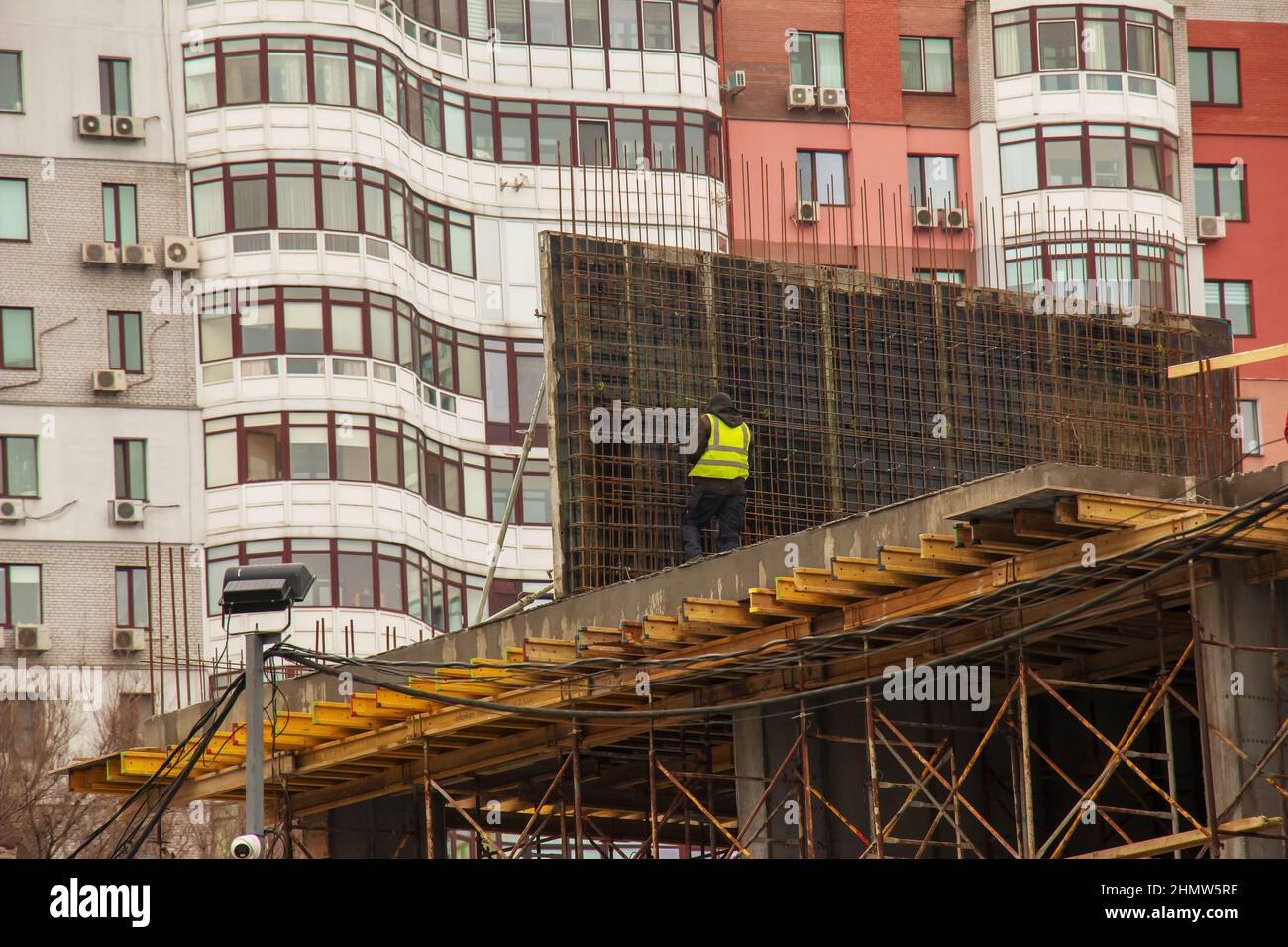 Construction site. The worker performs work at height Stock Photo - Alamy