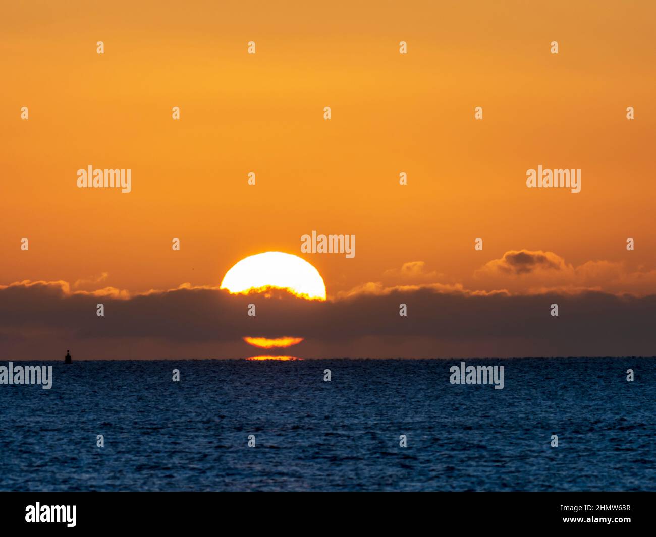 The sun rising at dawn over the North Sea from Beadnell, Northumberland ...