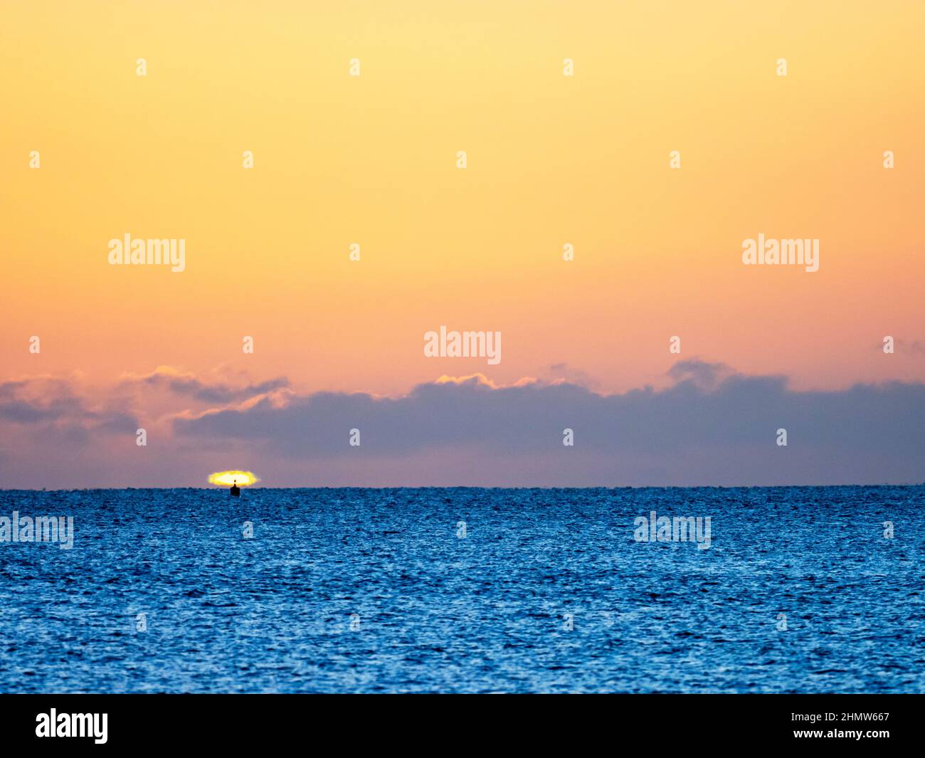 The sun rising at dawn over the North Sea from Beadnell, Northumberland ...
