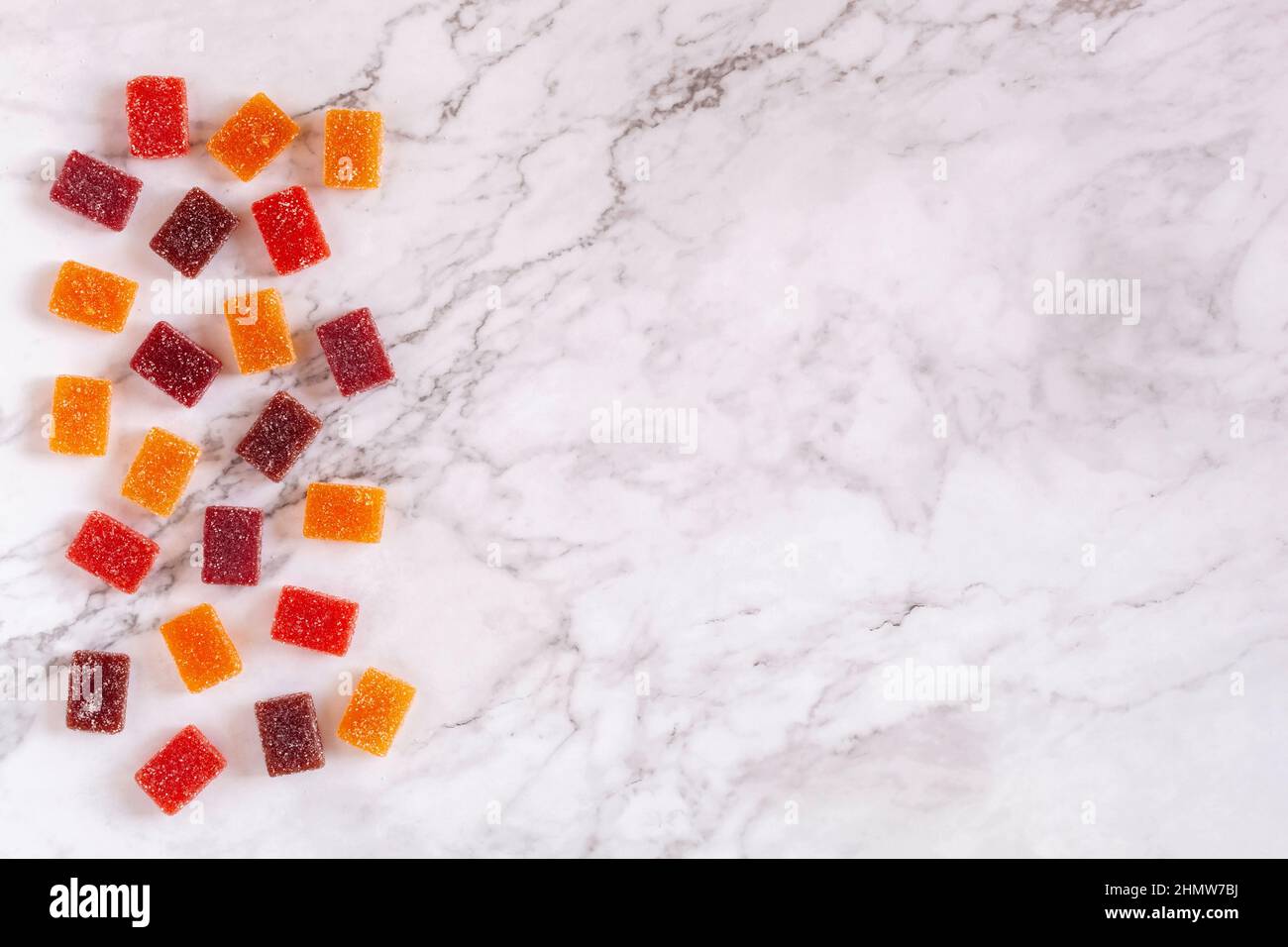 Different tastes of fruit paste on marble background, top view, copy ...