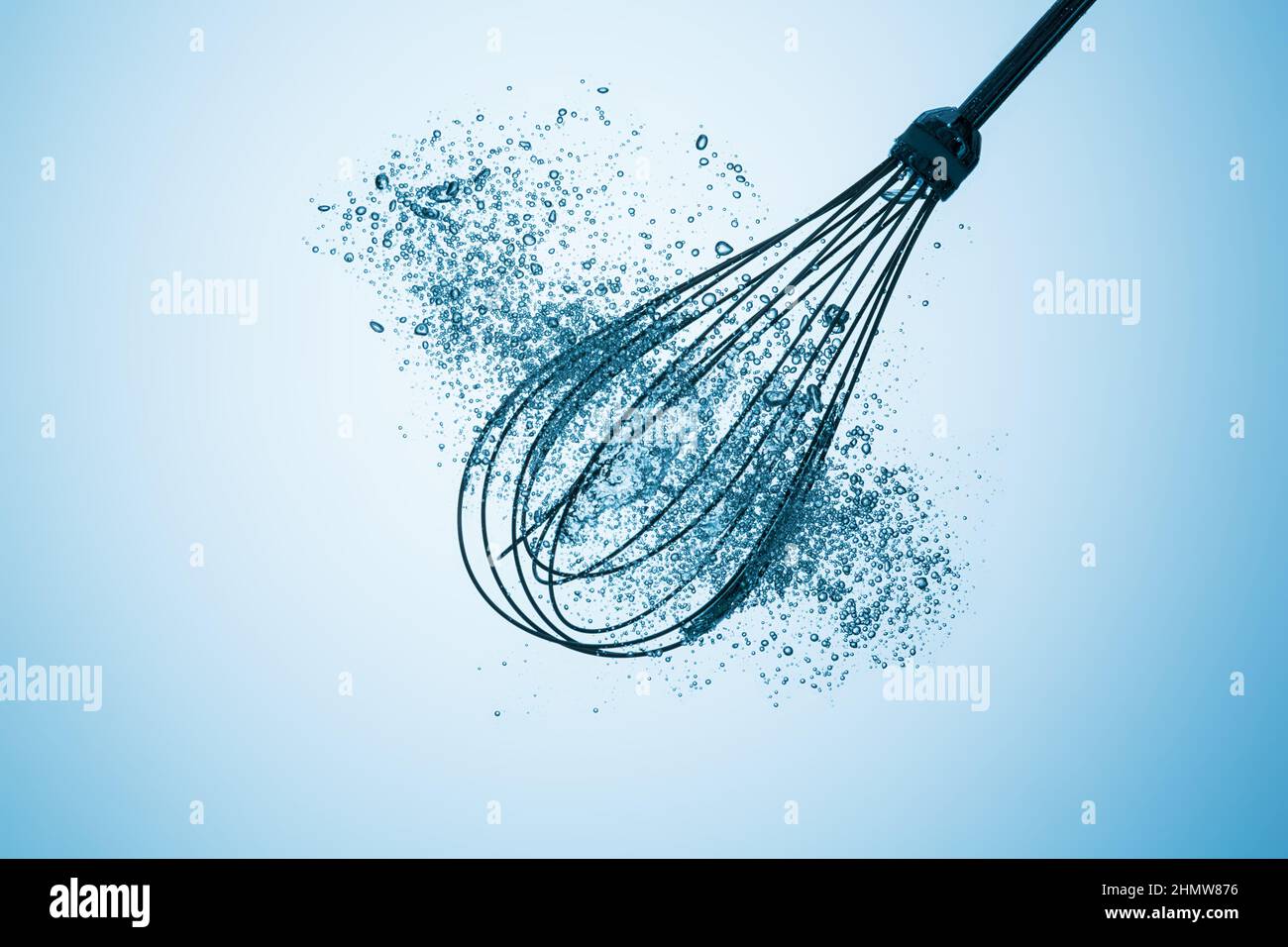 Wire Whisk in water Stock Photo - Alamy