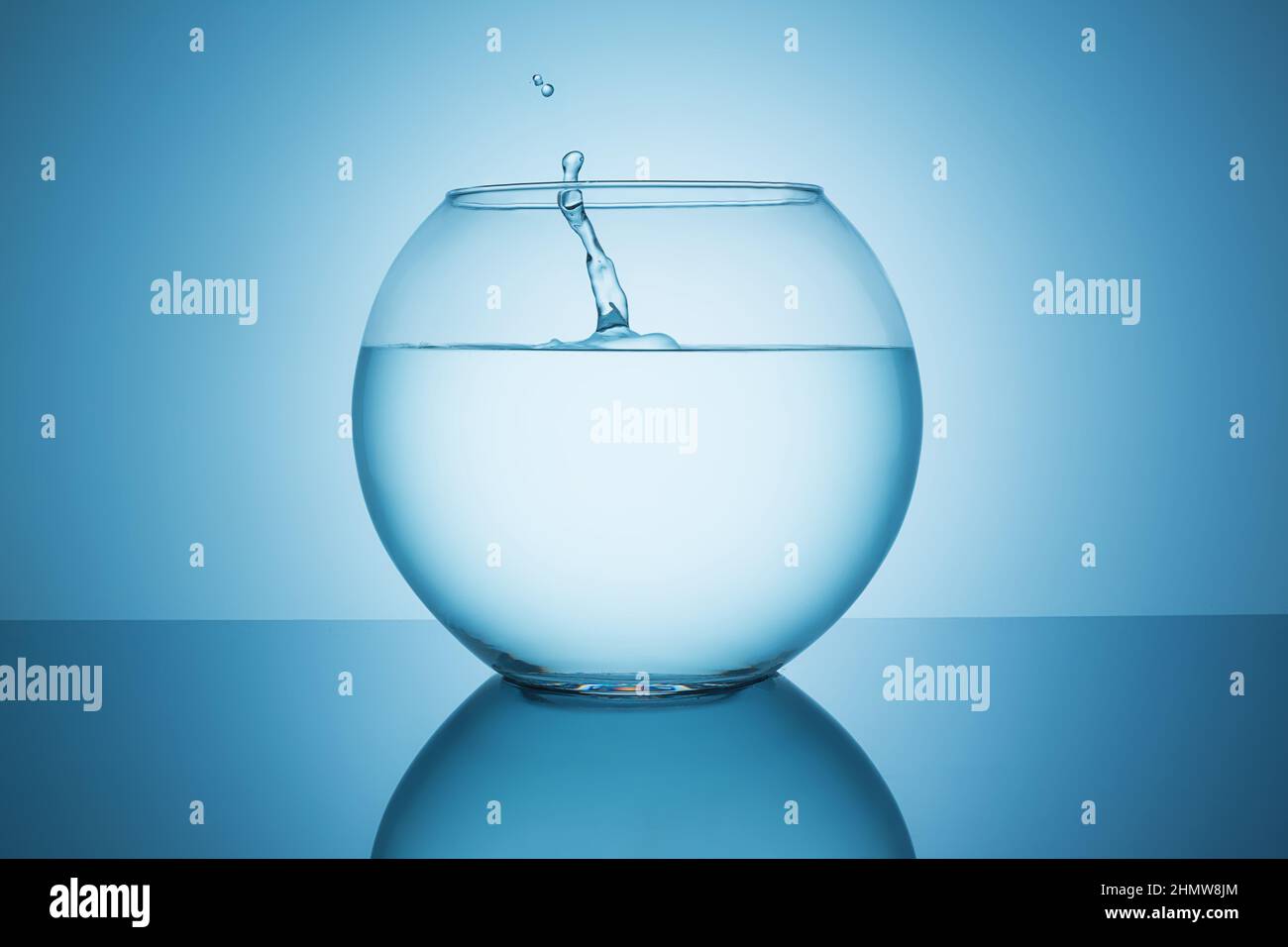 fishbowl with water splash Stock Photo - Alamy