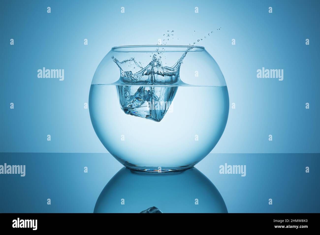 fishbowl with water splash impact Stock Photo - Alamy