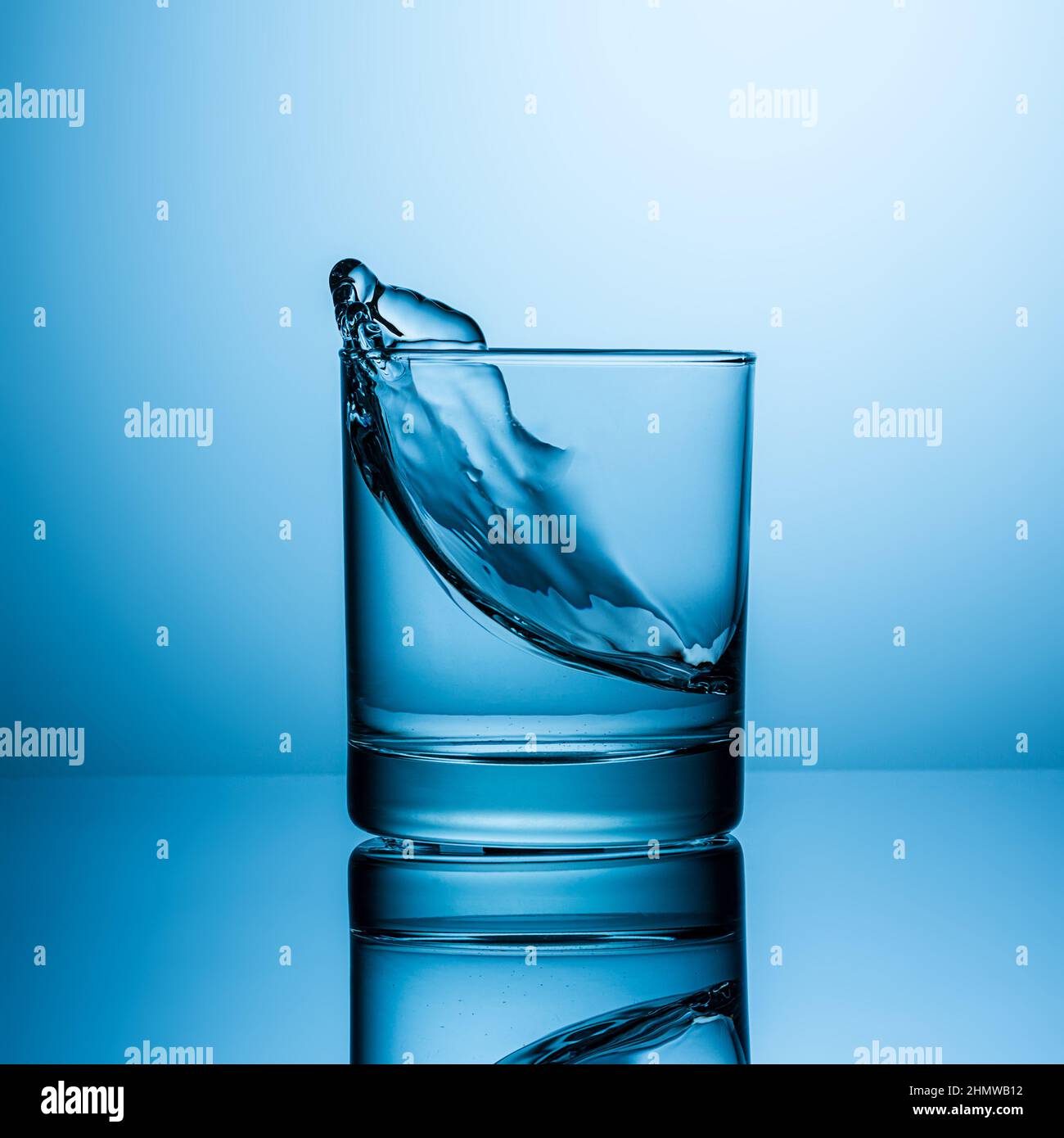 Splashing water in glass Stock Photo - Alamy
