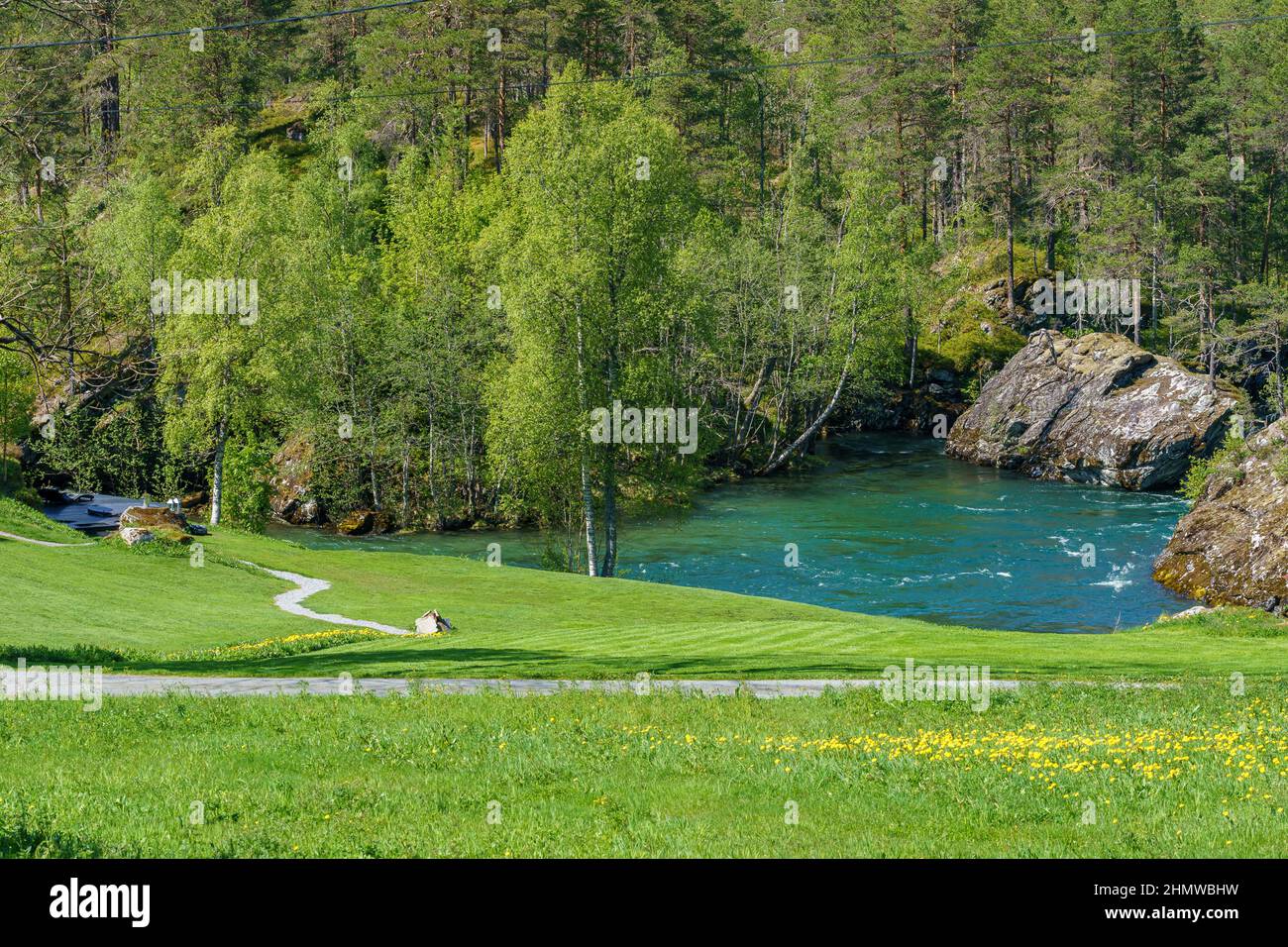 VALLDAL, NORWAY - 2020 MAY 31. Beautiful green river going through the ...