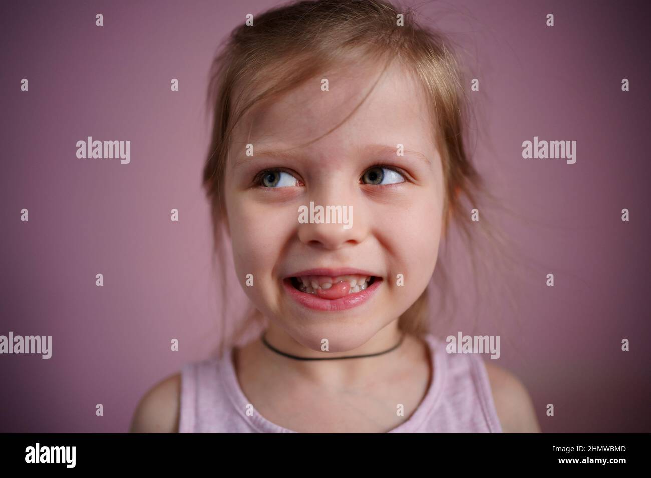 girl smiles without a front tooth Stock Photo - Alamy