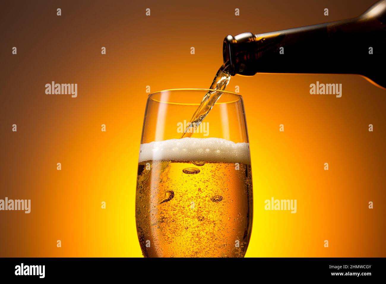 pouring cold beer in a glass Stock Photo - Alamy