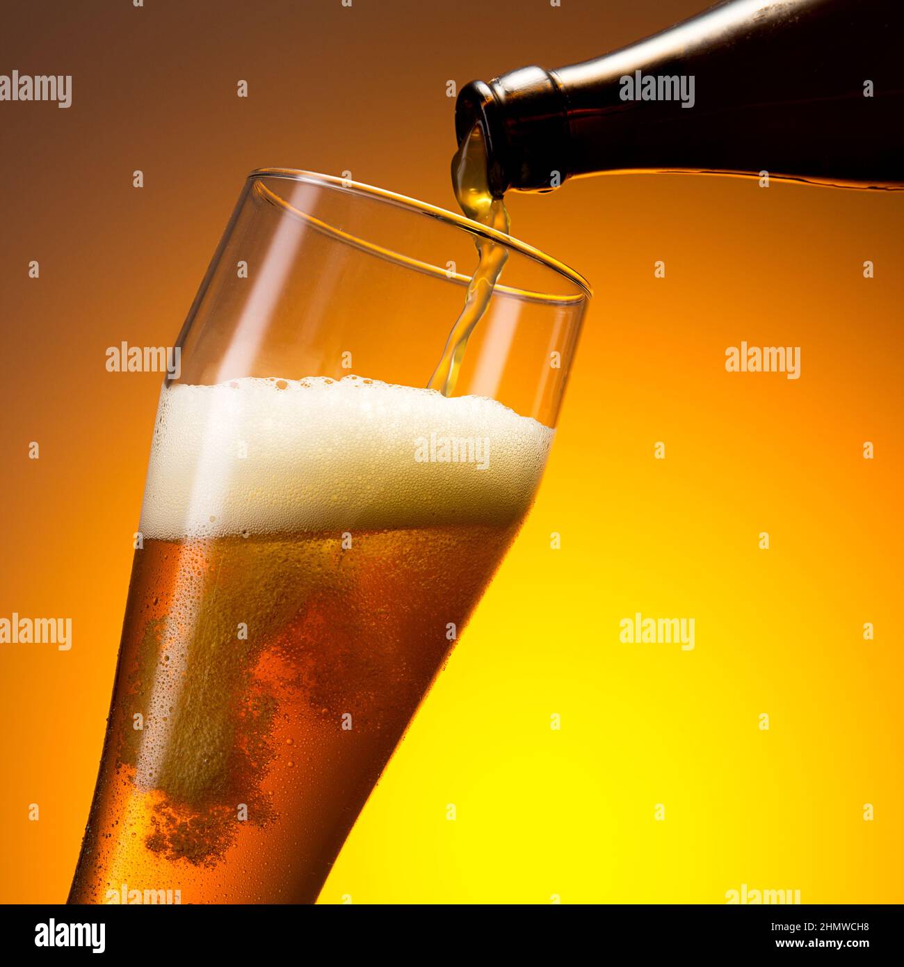wheat beer flows in to a glass Stock Photo - Alamy