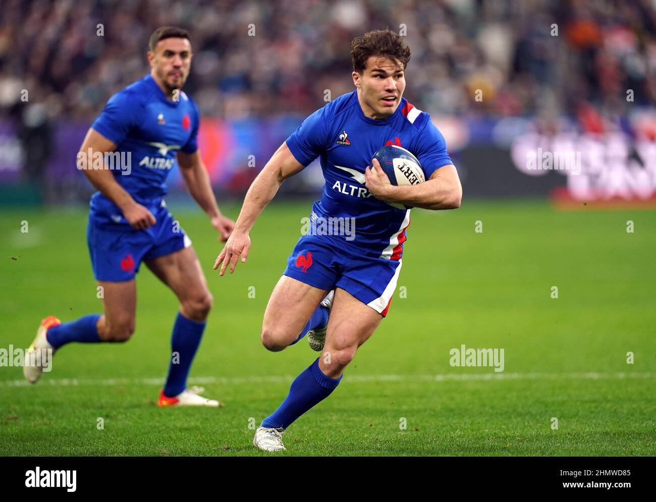 France's Antoine Dupont breaks clear to score a try during the Guinness Six Nations match at the ...