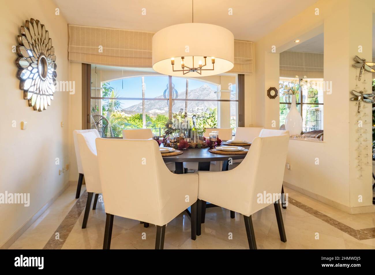 a view of a dining room table inside a spacious villa along the costa ...