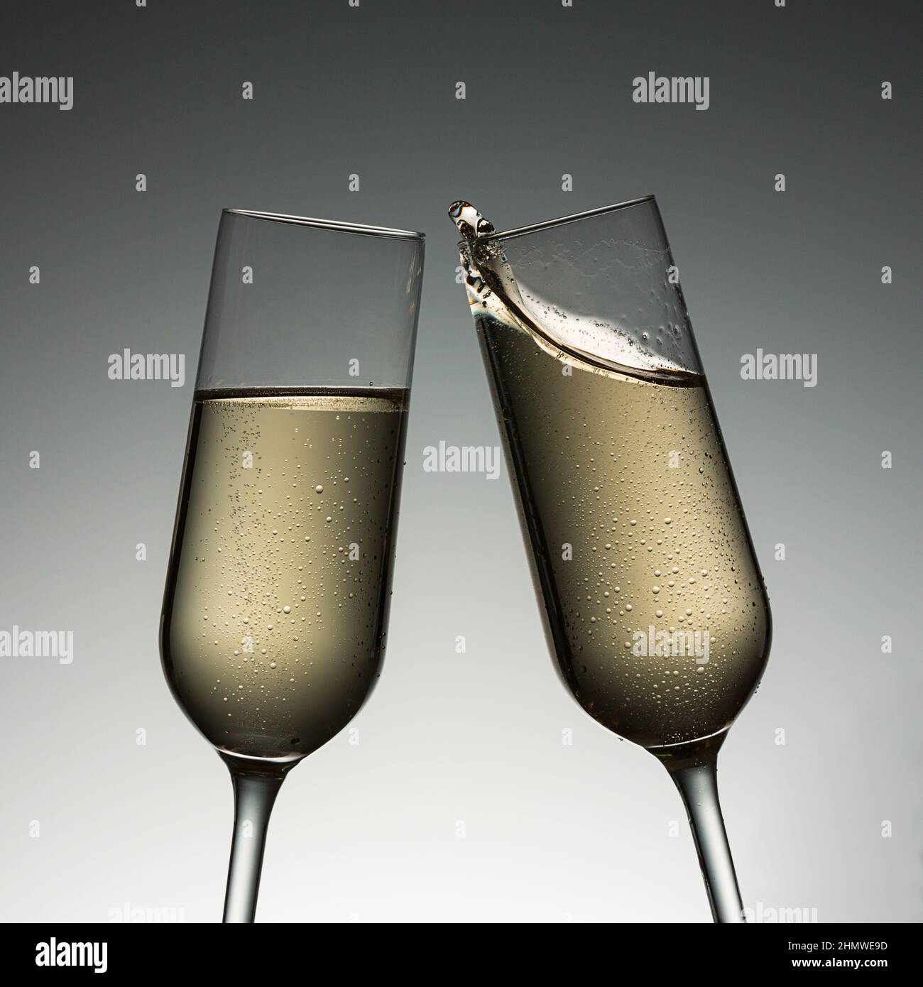 clink glasses with champagne splash Stock Photo - Alamy clink glasses with champagne splash Stock Photo - Alamy