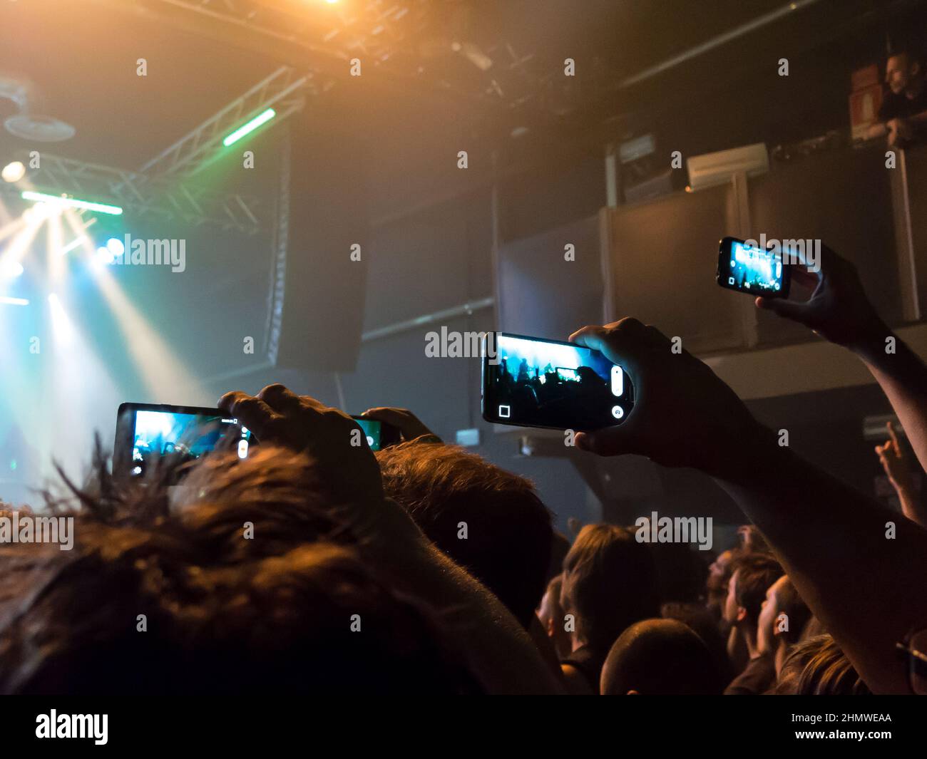 Concert spectators in front of a bright stage with live music Stock ...