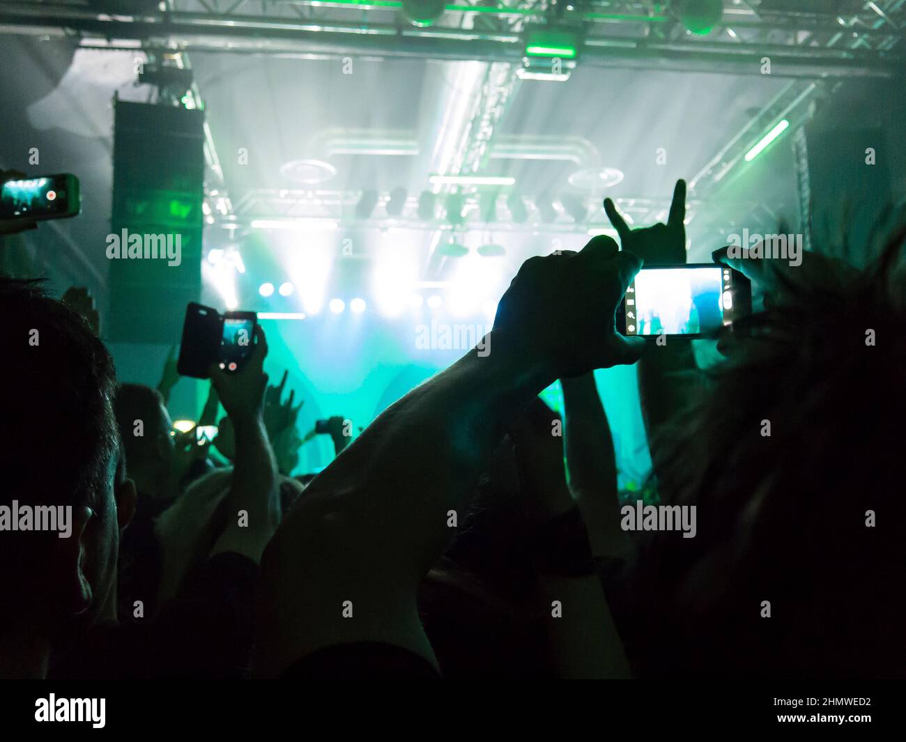 Concert spectators in front of a bright stage with live music Stock ...
