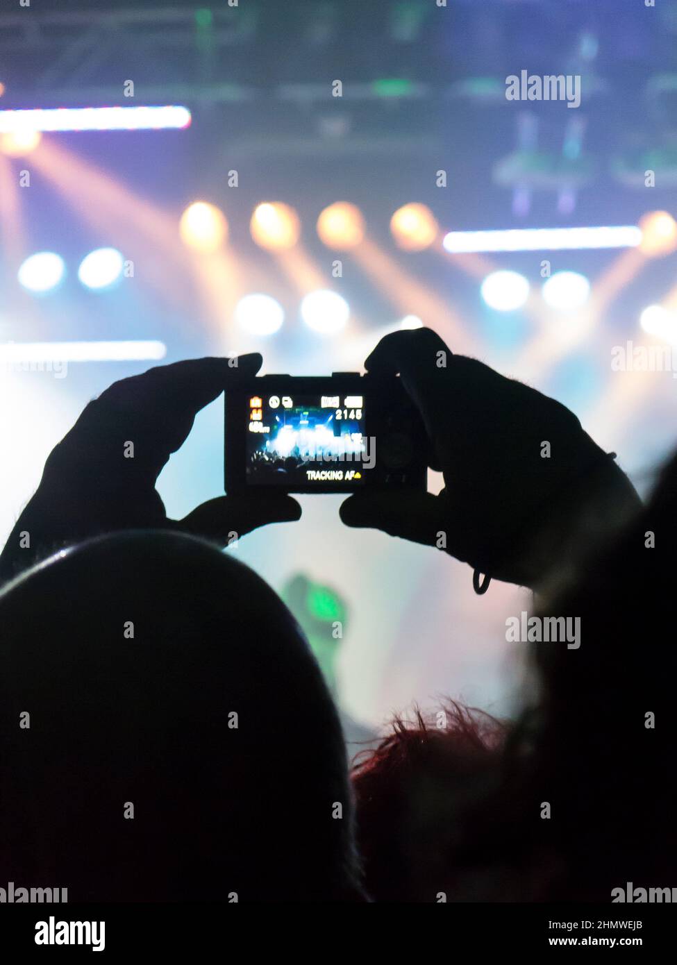 Concert spectators in front of a bright stage with live music Stock ...