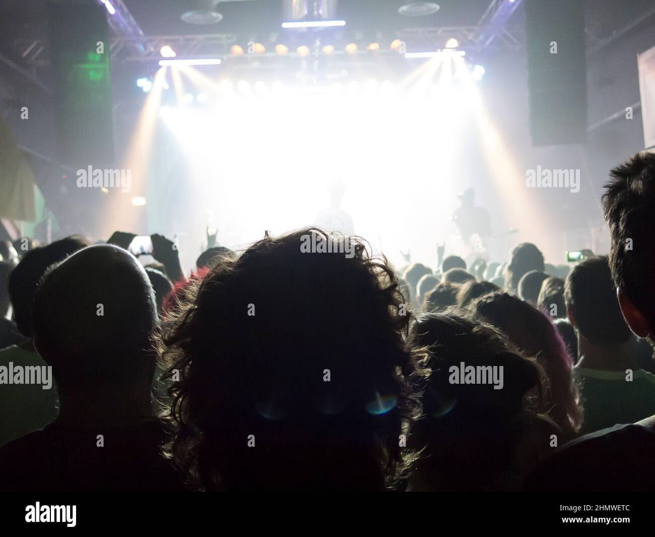 Concert spectators in front of a bright stage with live music Stock ...