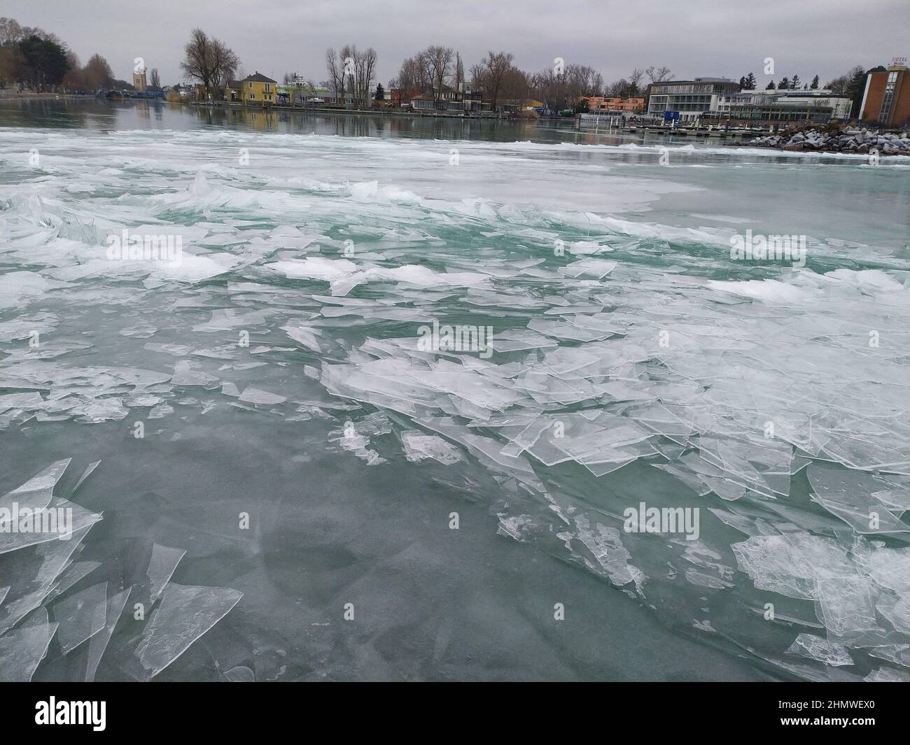 View of broken pieces of ice on a frozen water Stock Photo - Alamy