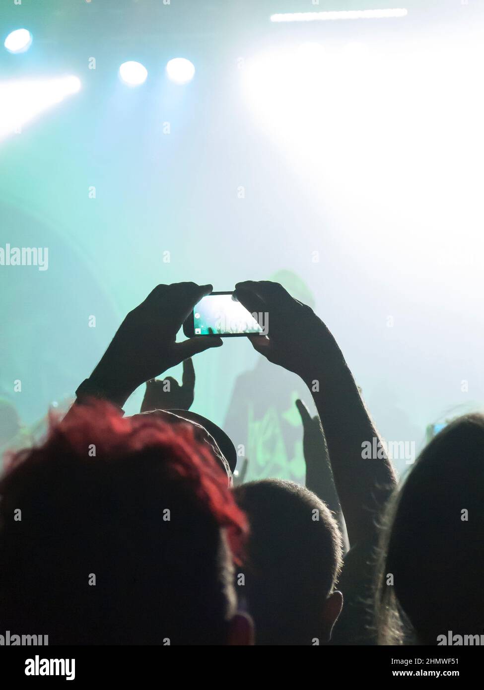 Concert spectators in front of a bright stage with live music Stock ...