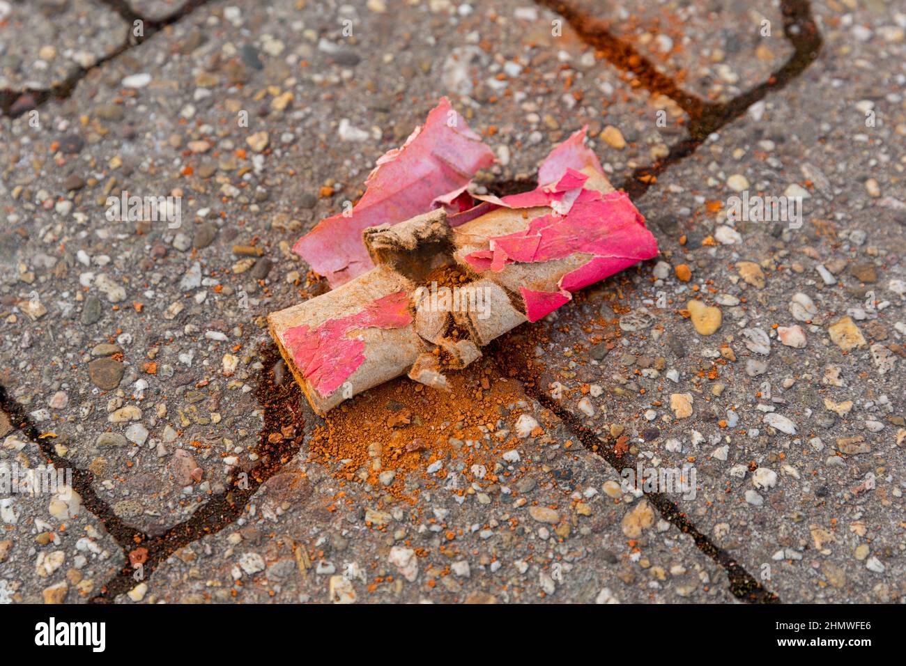 Scattered pieces of a firecracker are spread on the ground Stock Photo ...