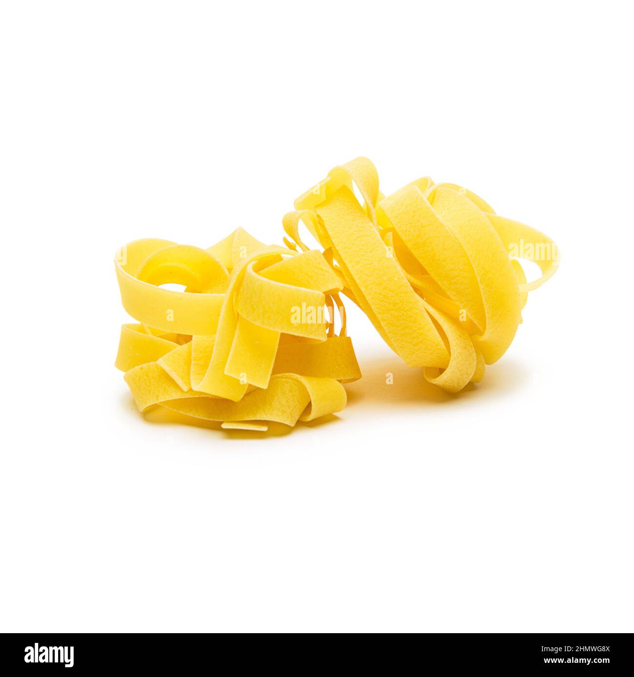 Fettuccine nests pasta Cut Out Stock Images & Pictures - Alamy