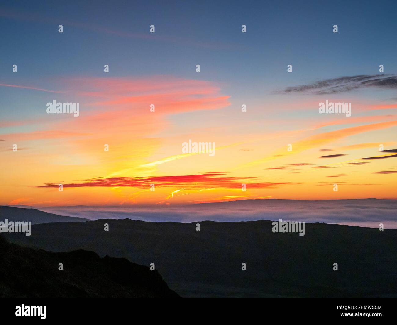 Valley mist from a temperature inversion at dawn on Wansfell, Ambleside ...