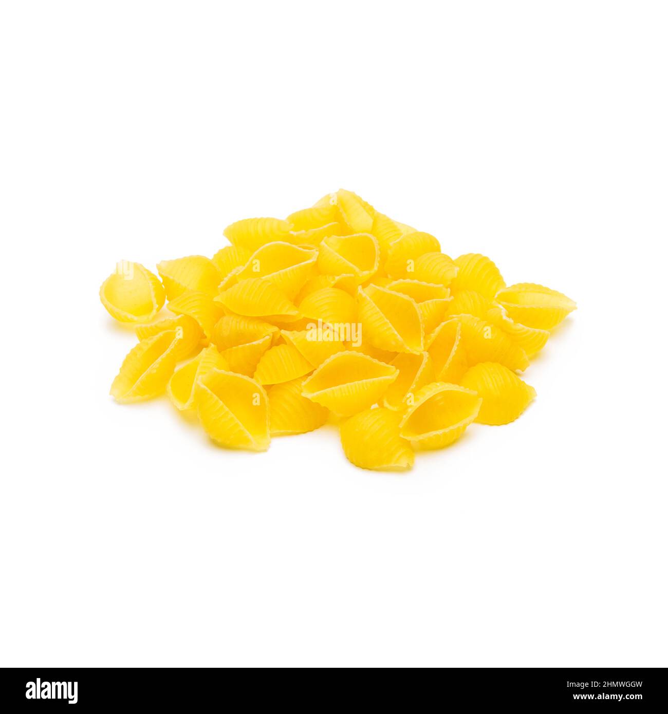 Pasta shells (conchiglie) on white Stock Photo - Alamy